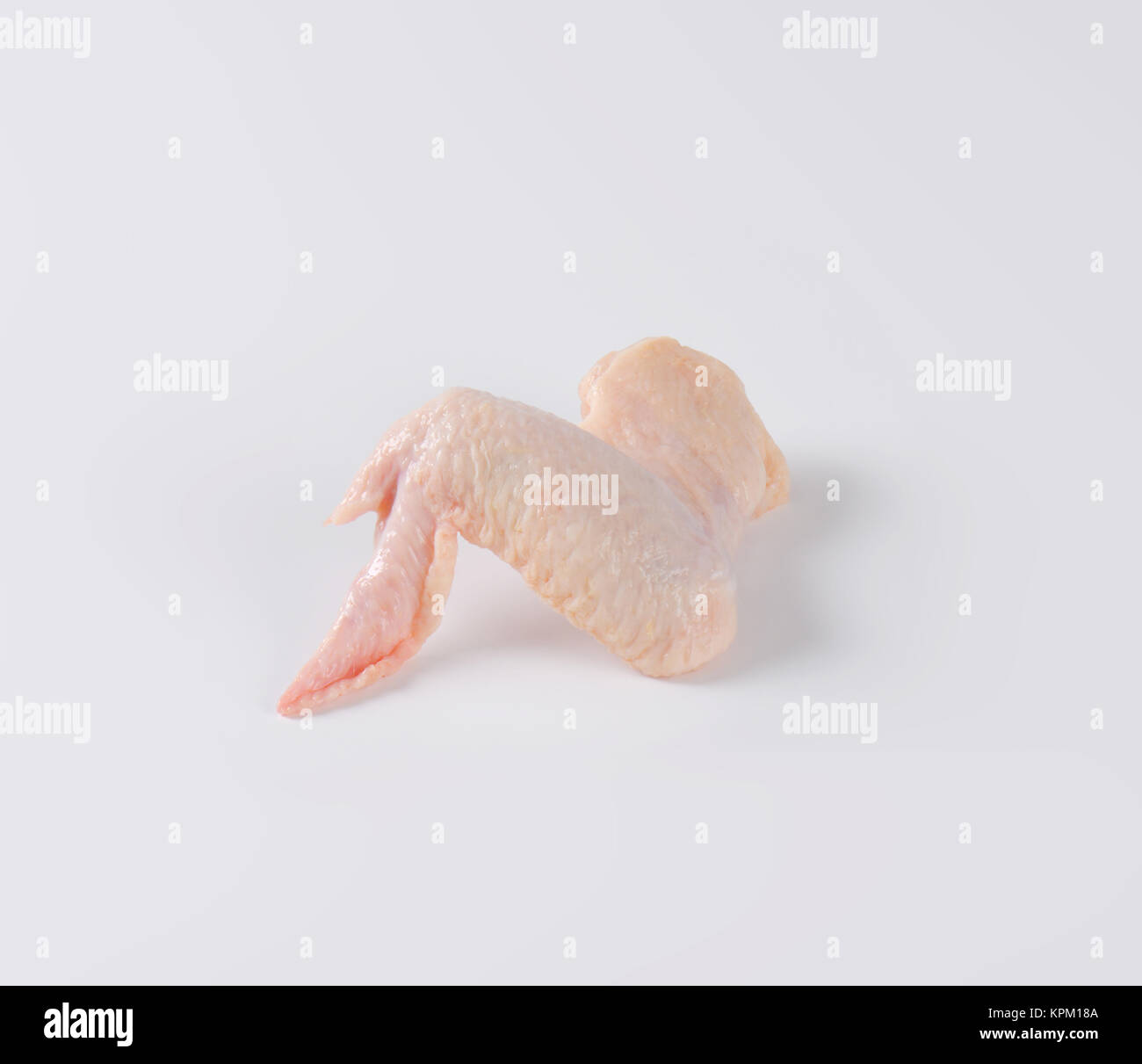 single raw chicken wing Stock Photo - Alamy
