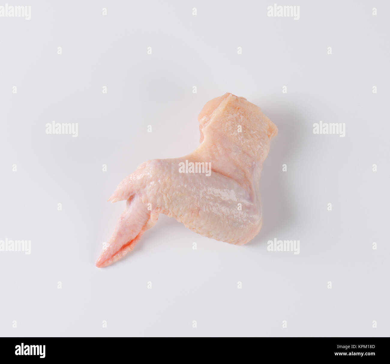 single raw chicken wing Stock Photo - Alamy