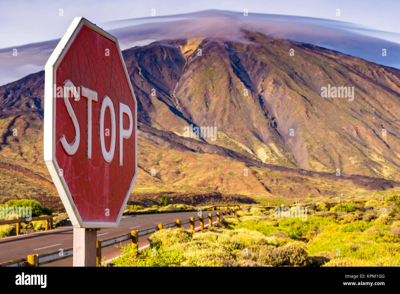 Stop sign in nature mountain landscape road Stock Photo - Alamy