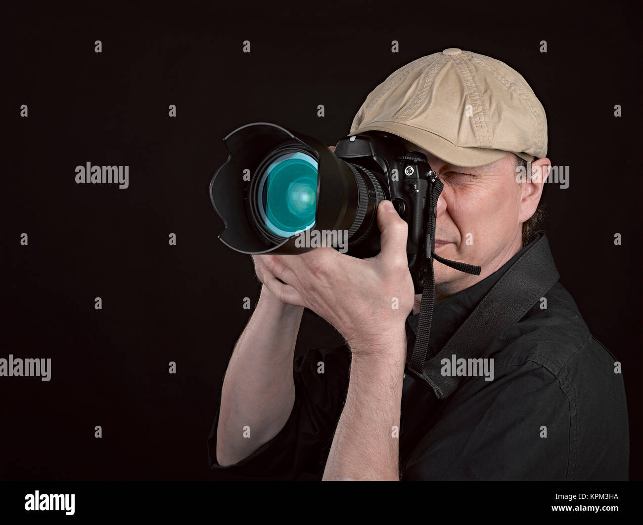 Photographer looking through camera Stock Photo - Alamy