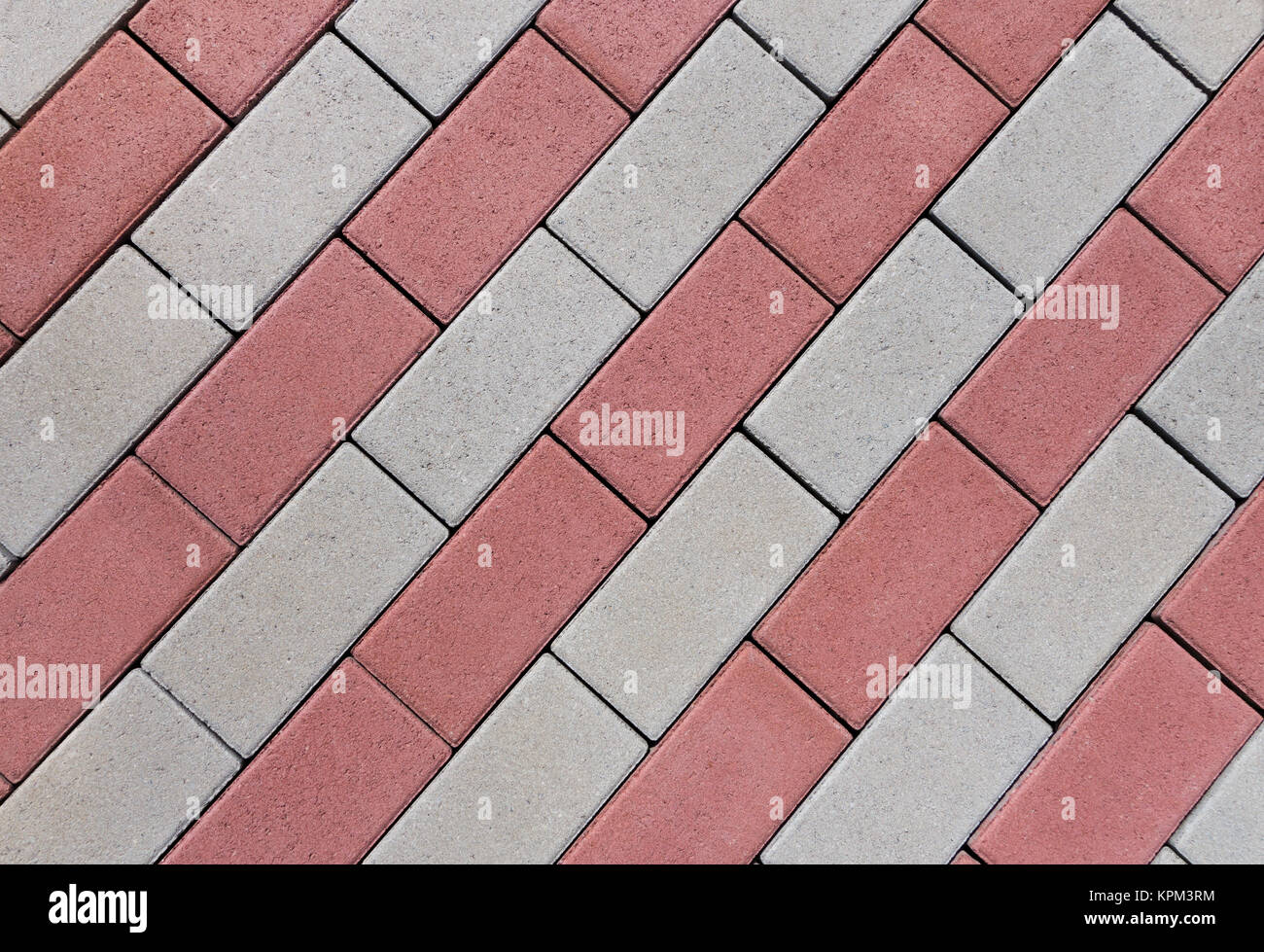 Diagonal pattern of rows of red and grey paving stones Stock Photo - Alamy