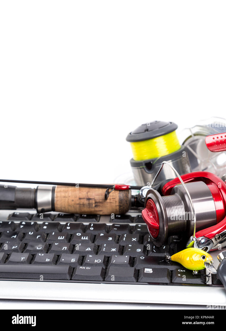 fishing tackles on computer keyboard Stock Photo - Alamy