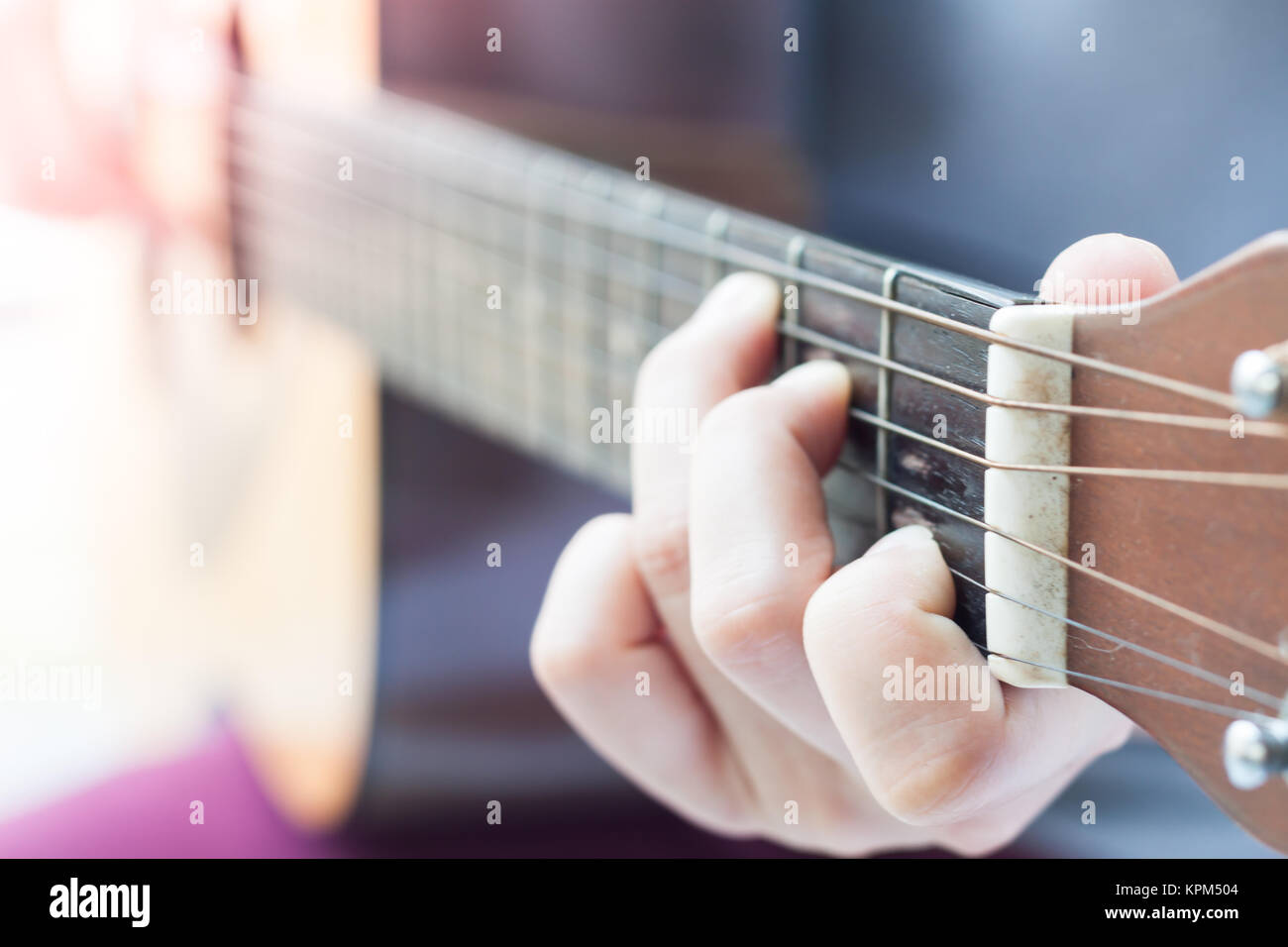 Woman's hands playing acoustic guitar Stock Photo - Alamy