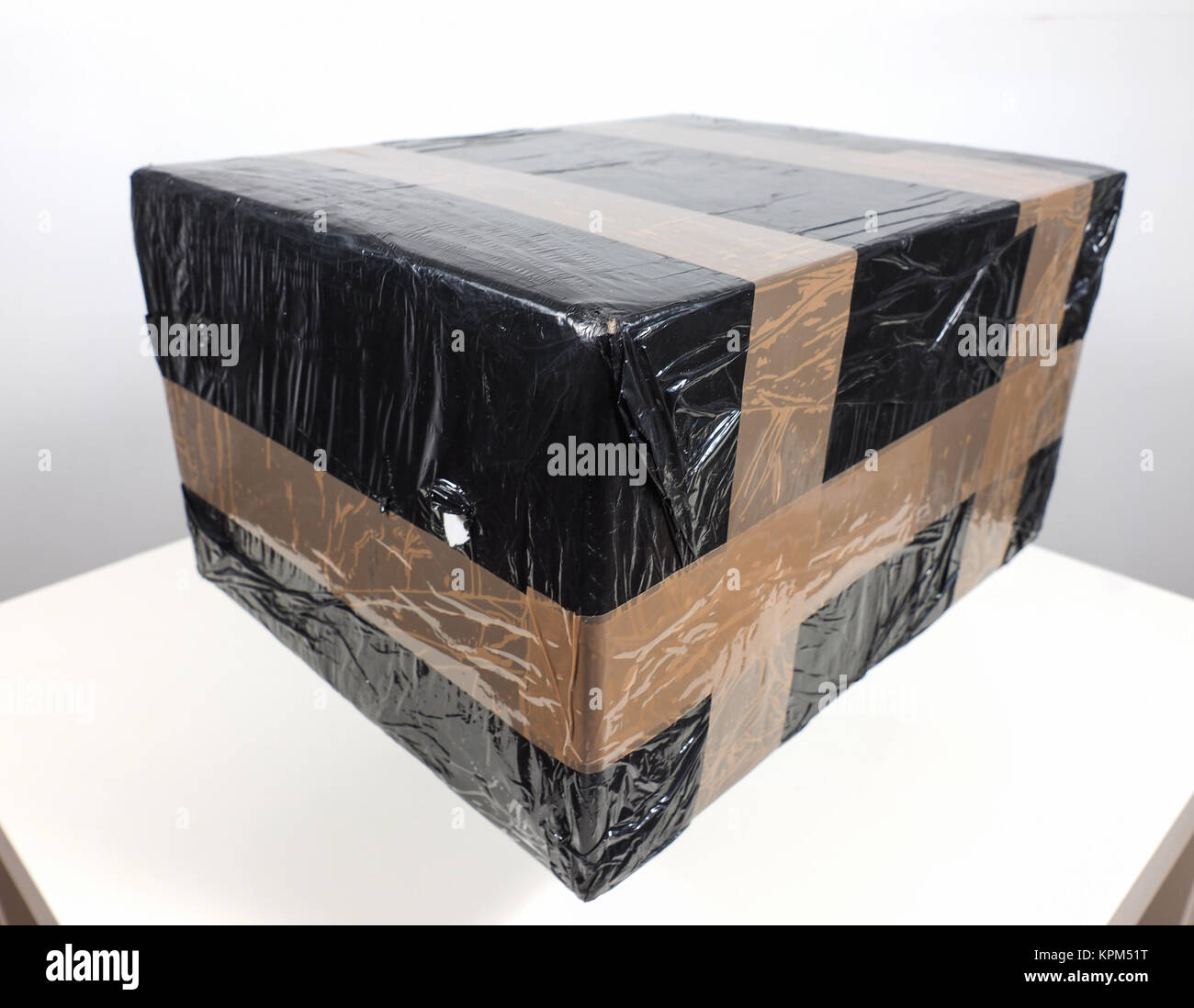 black packet parcel Stock Photo - Alamy