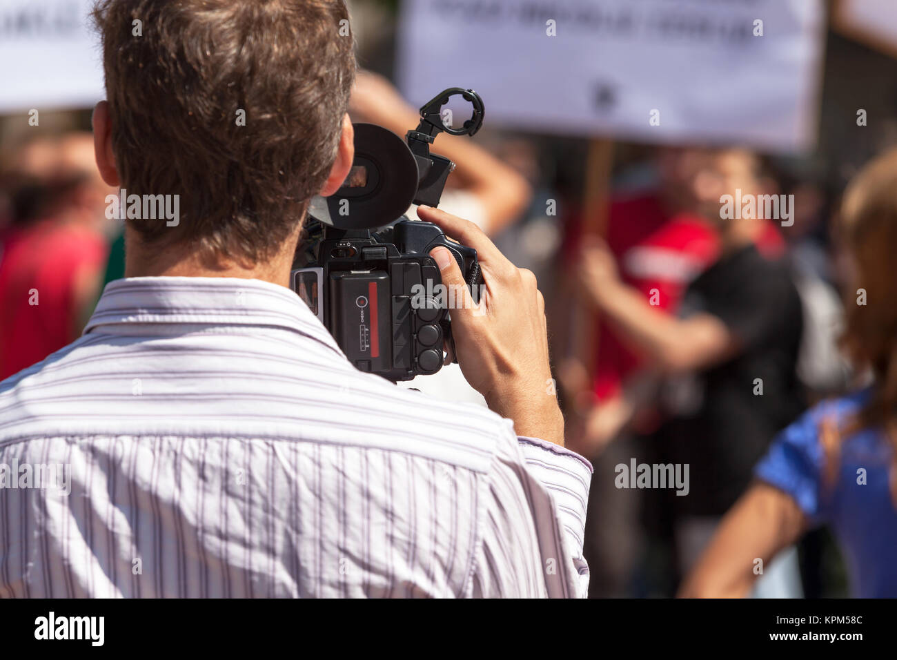 Filming demonstration with a video camera Stock Photo - Alamy