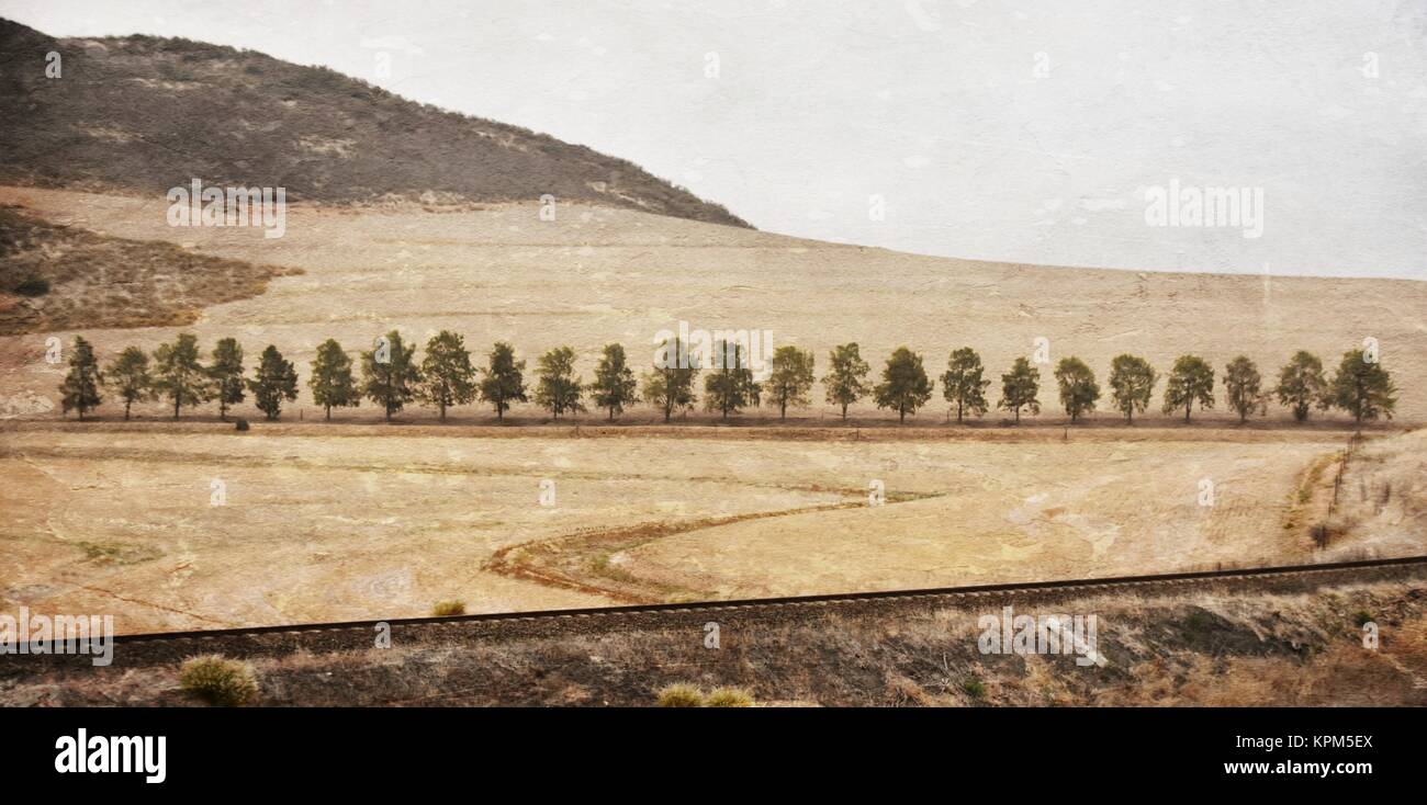 Landscape with dry farm land and a railway line Stock Photo - Alamy