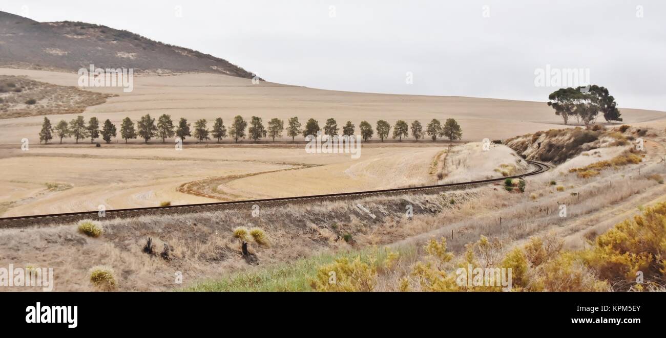 Landscape with dry farm land and a railway line Stock Photo - Alamy