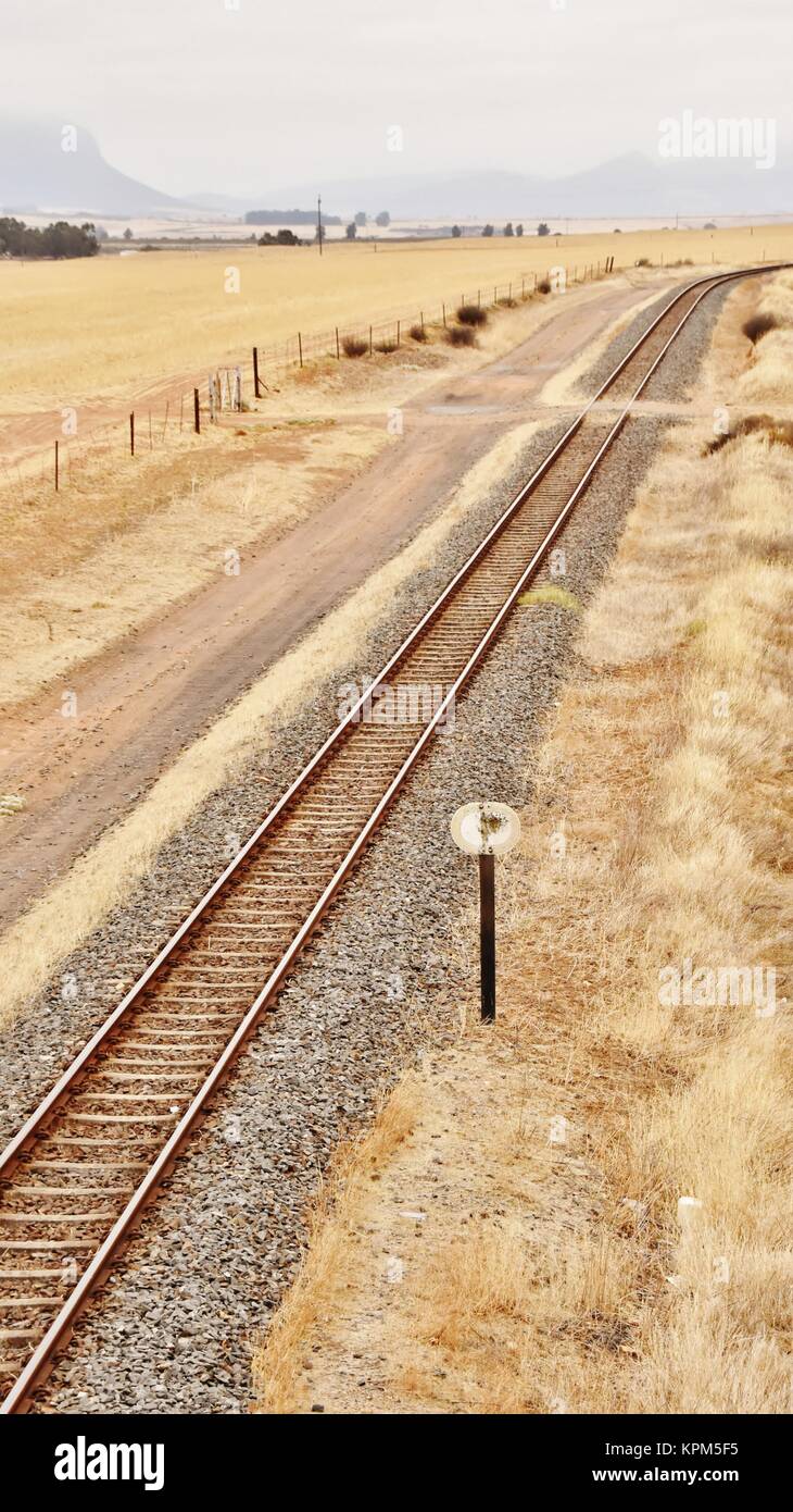 Landscape with dry farm land and a railway line Stock Photo - Alamy