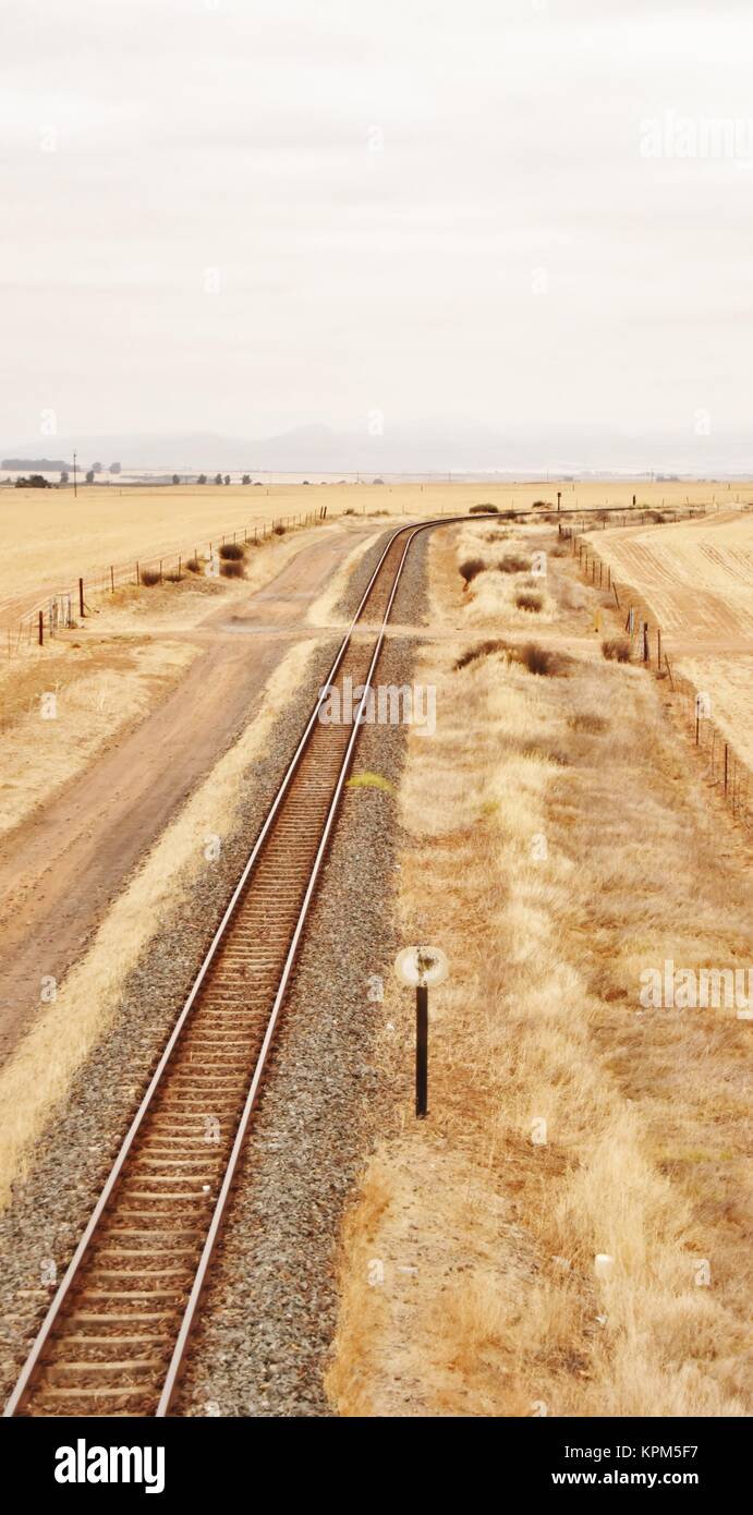Landscape with dry farm land and a railway line Stock Photo - Alamy