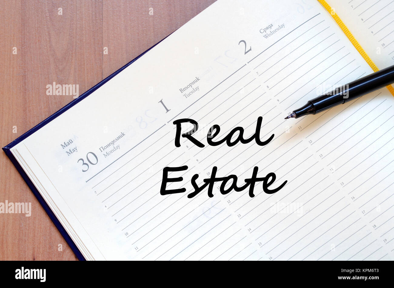 Real estate write on notebook Stock Photo - Alamy