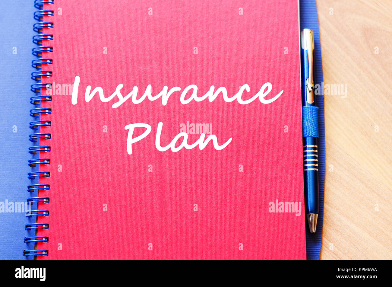 Insurance plan write on notebook Stock Photo - Alamy