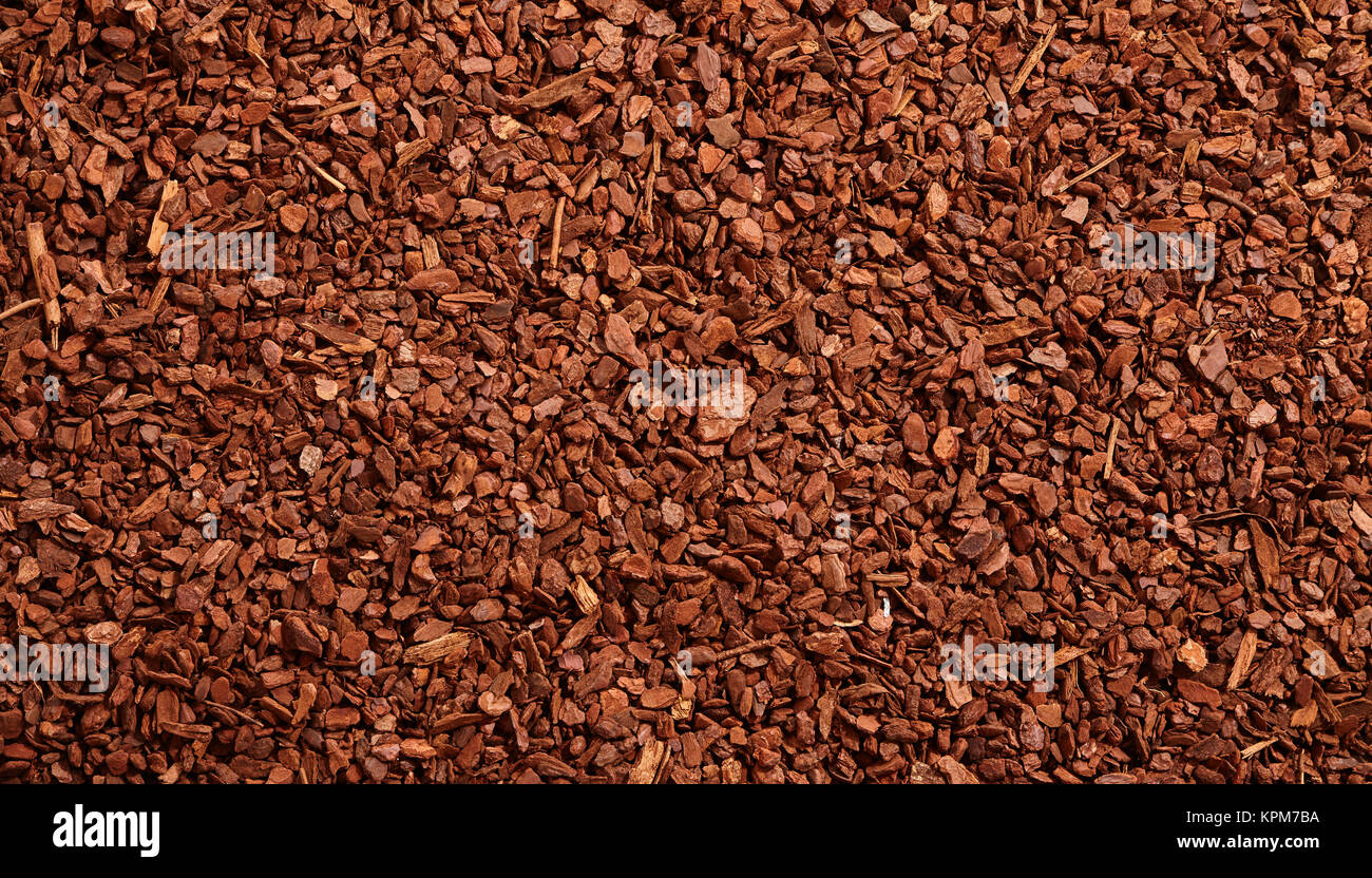 Top down full frame background of brown natural tree bark mulch with ...
