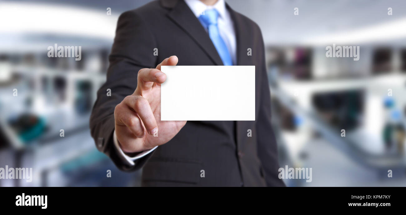 Businessman holding business card Stock Photo - Alamy