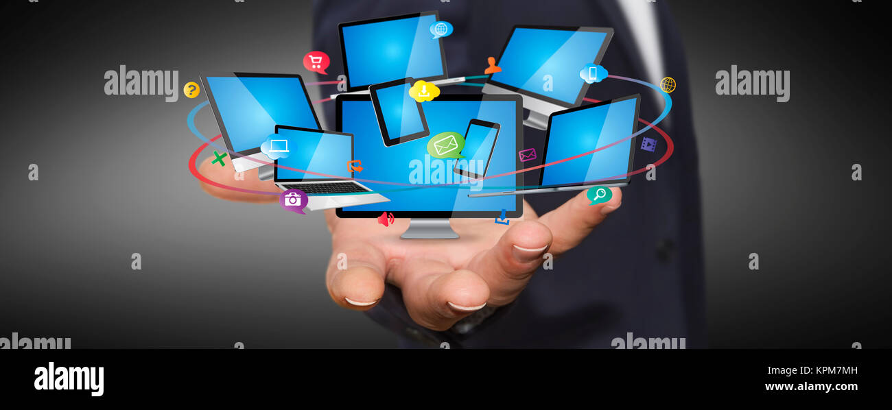 Businessman connecting tech devices Stock Photo - Alamy