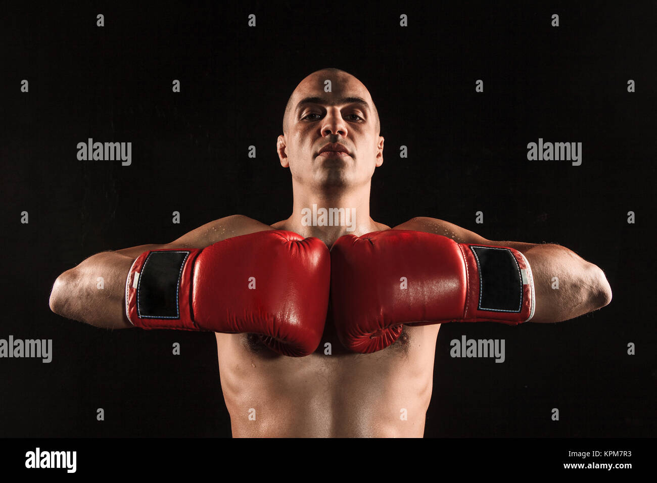 The young man kickboxing on black Stock Photo - Alamy