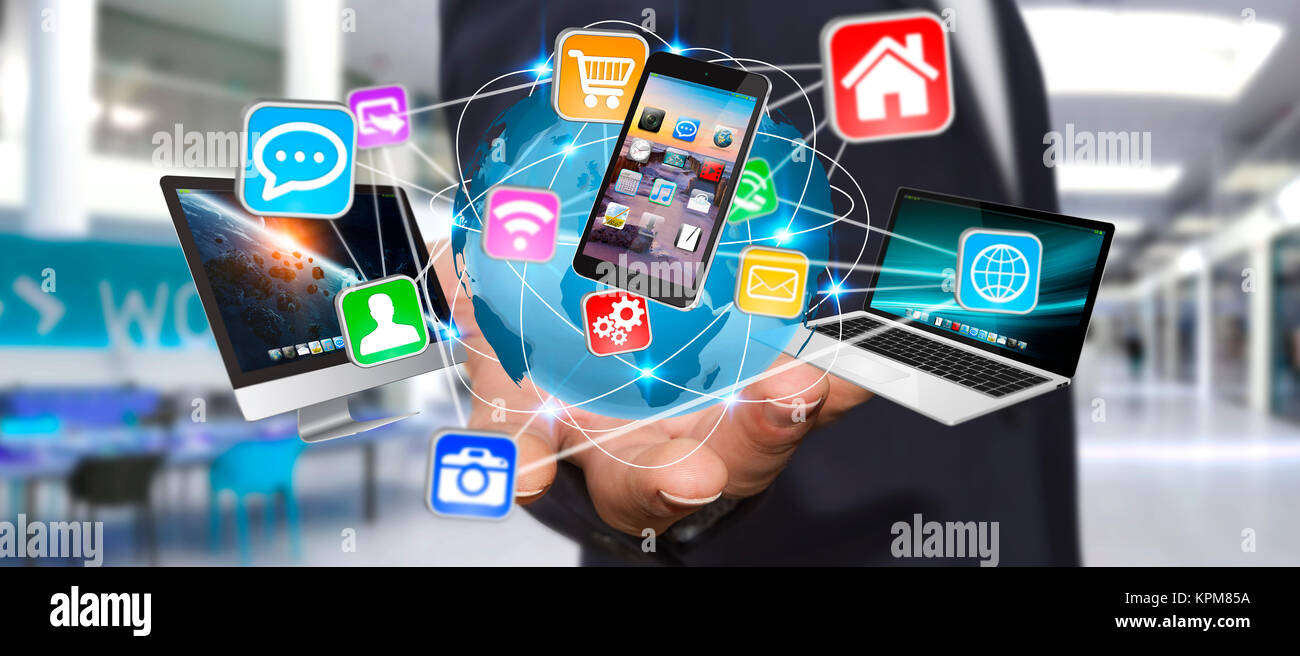 Businessman connecting tech devices Stock Photo - Alamy