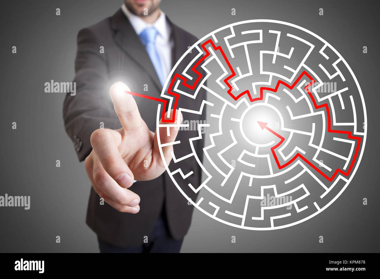 Businessman playing with digital maze Stock Photo - Alamy