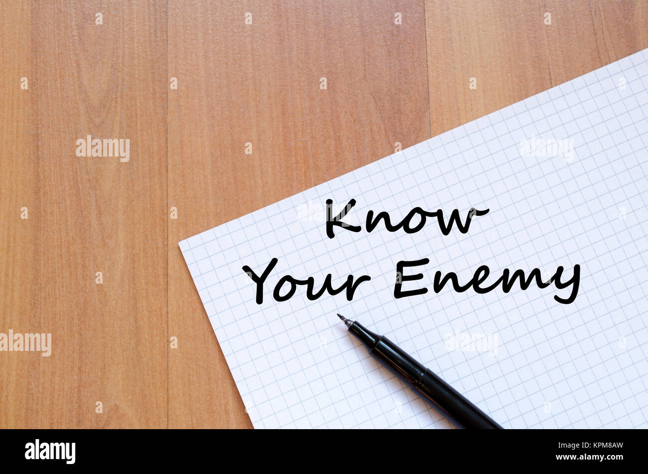 Know your enemy write on notebook Stock Photo - Alamy