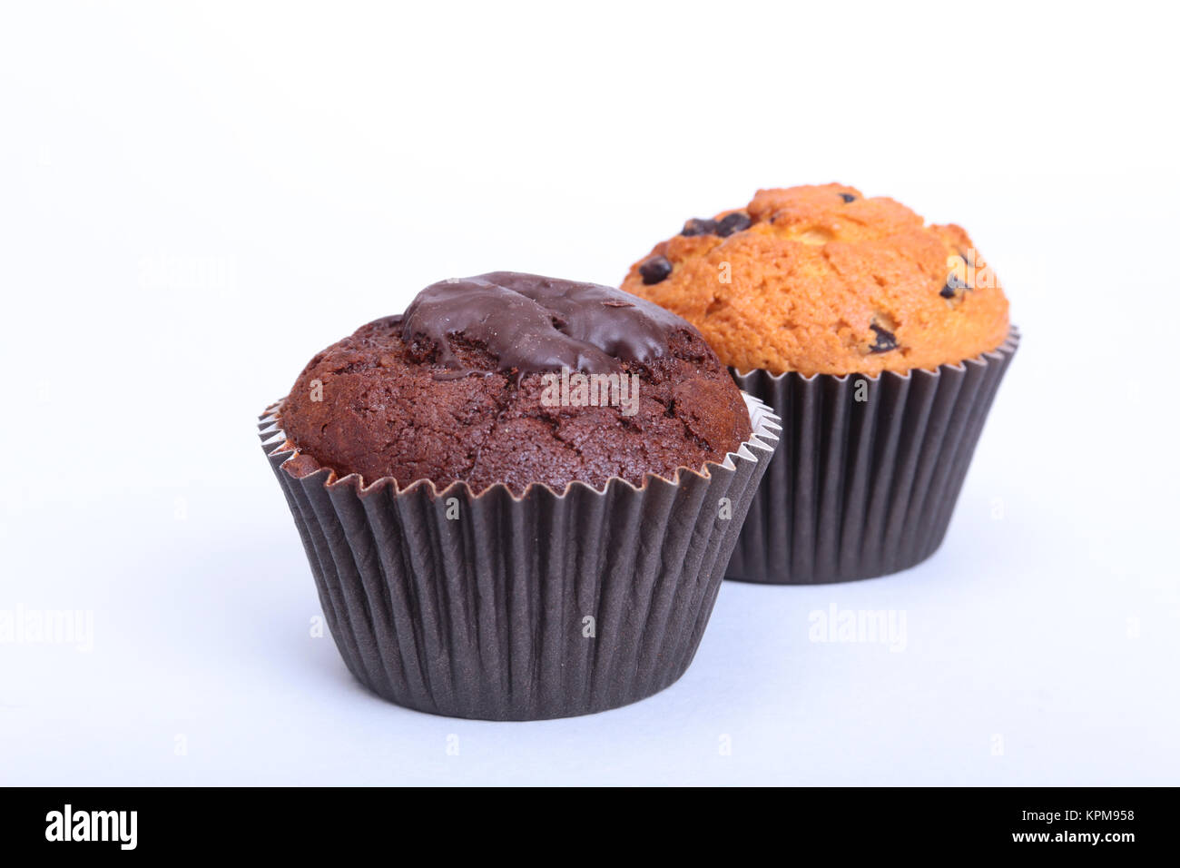 Fresh homemade muffins on white background. Top view Stock Photo - Alamy