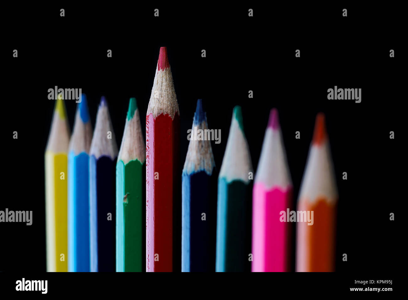 Collection of colored pencils on black background Stock Photo - Alamy