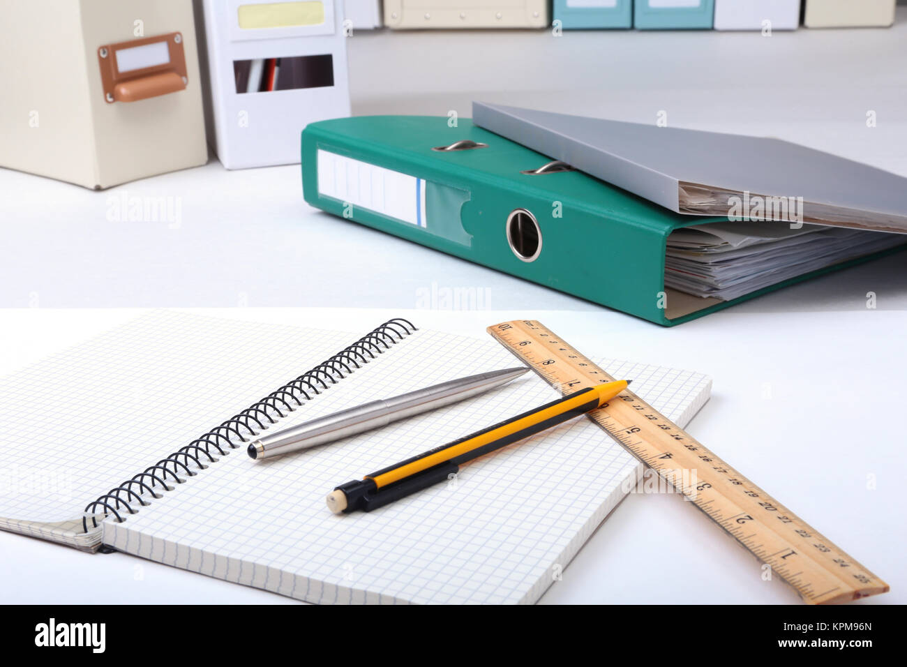 Folder file and note on the desk. blurred background Stock Photo - Alamy