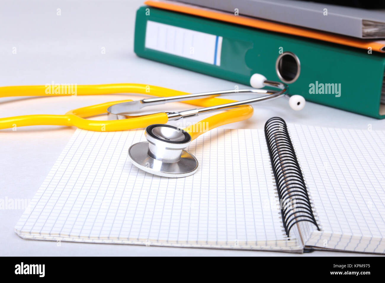 Folder file, stethoscope and RX prescription on the desk. blurred ...