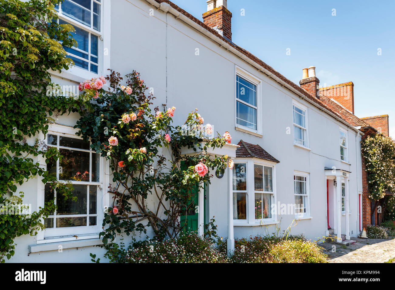 Cottages with pink roses in front by the doorway, West Itchenor, a ...