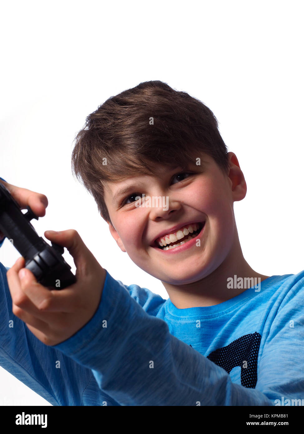 Young boy playing video games on a white studio background Stock Photo ...