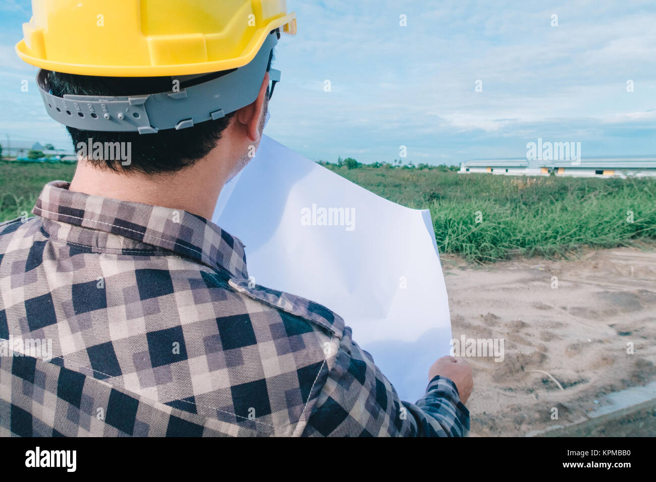 Young Architect Helmet yellow Construction of new road Stock Photo - Alamy