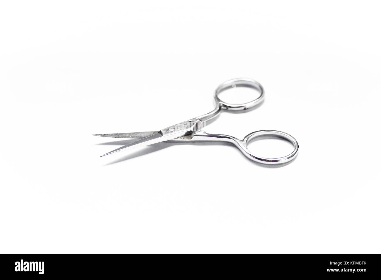 Medical scissors equipment on white background Stock Photo - Alamy