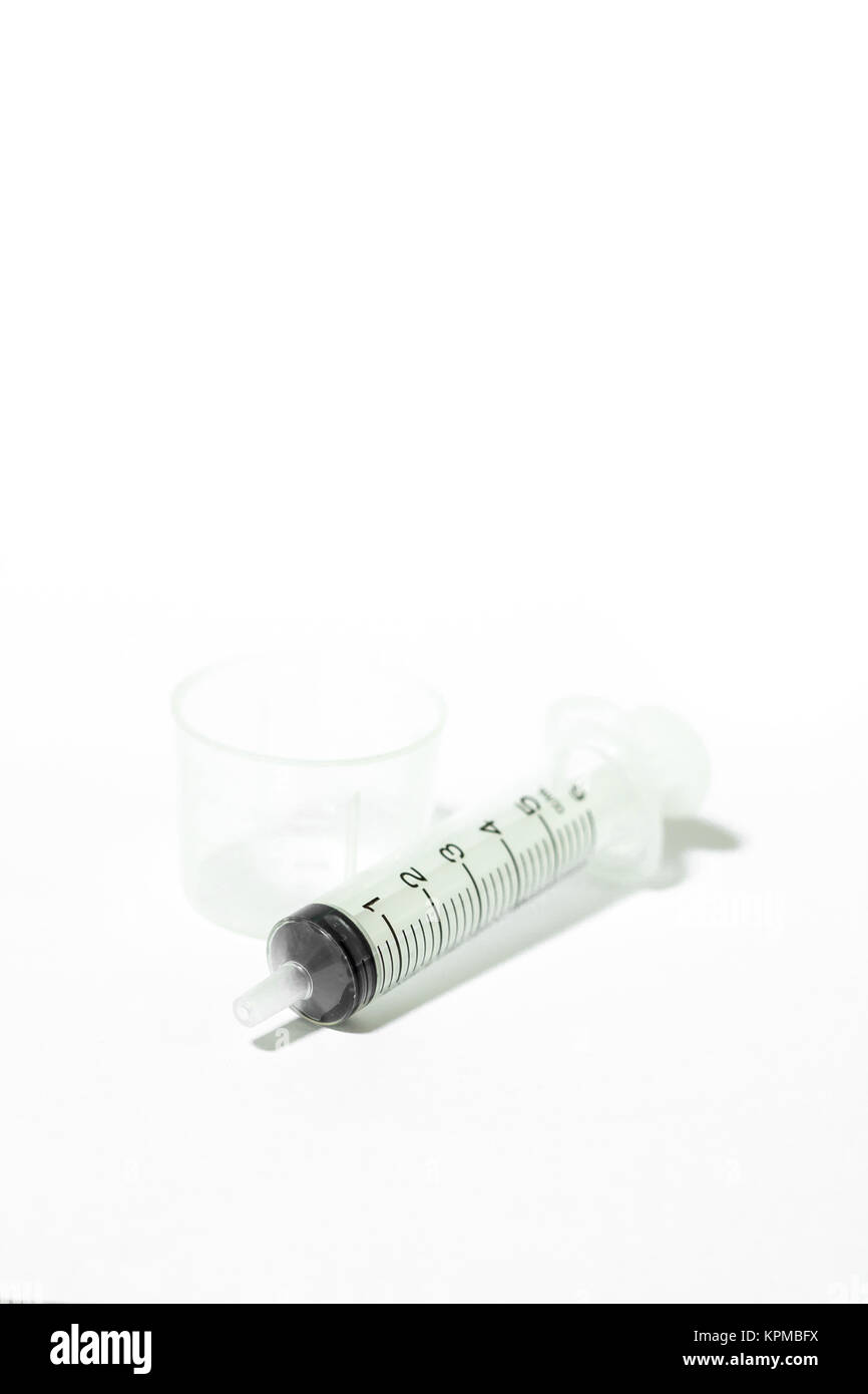 Medium feeding syringe on white background Stock Photo - Alamy