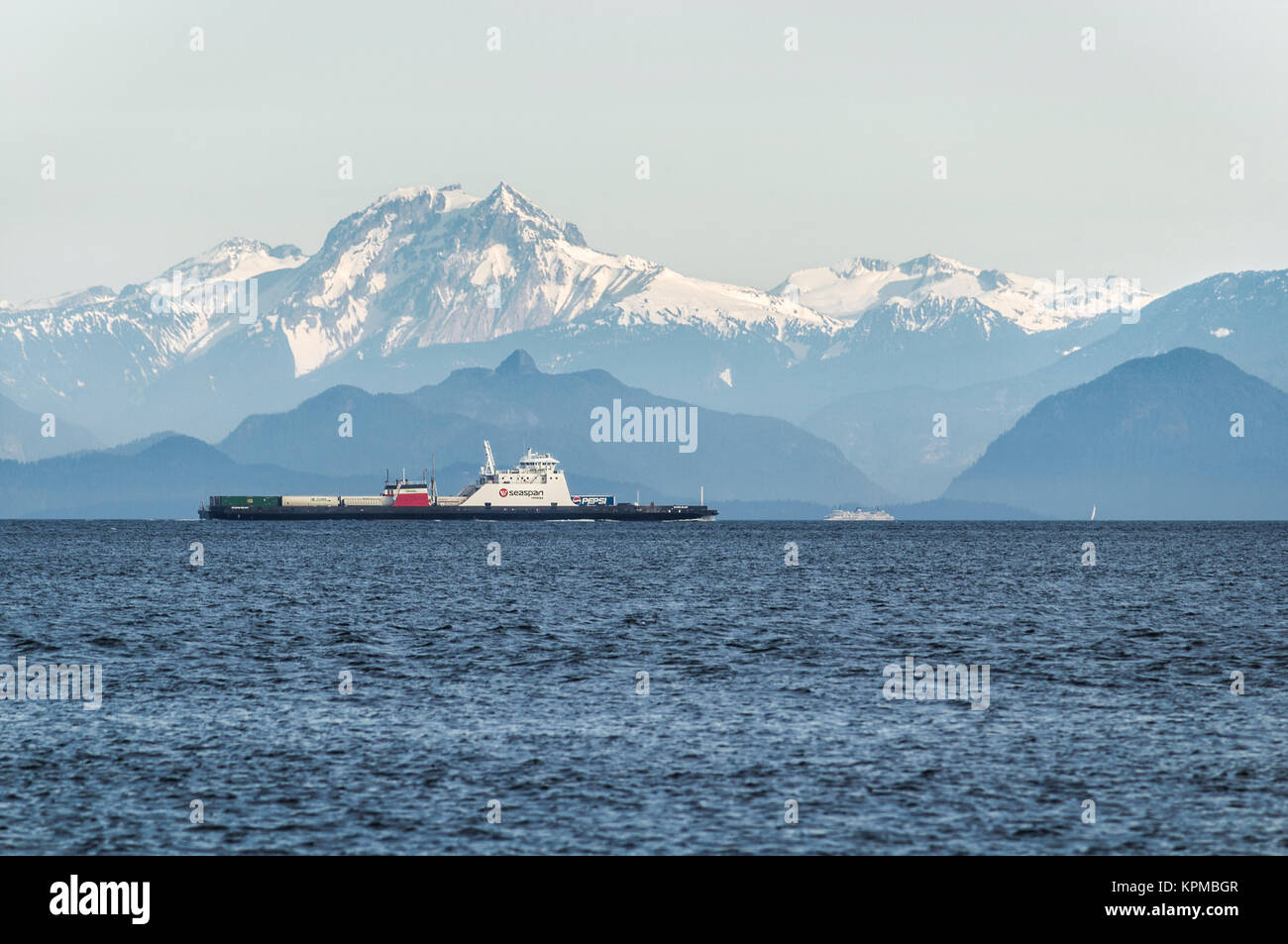 The freight ferry Seaspan Reliant crosses the Strait of Georgia, with a ...