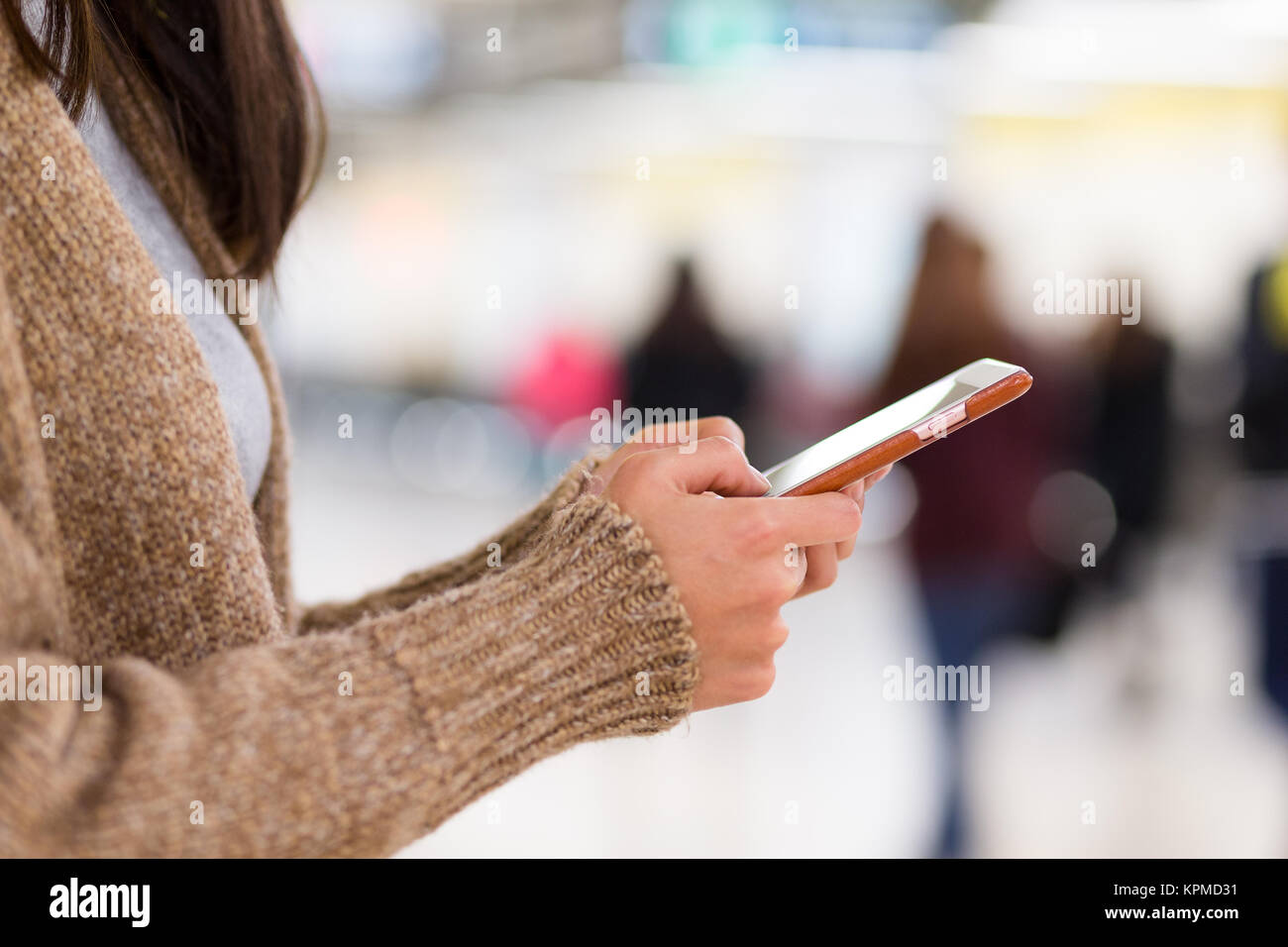 Woman sending message on cellphone Stock Photo - Alamy