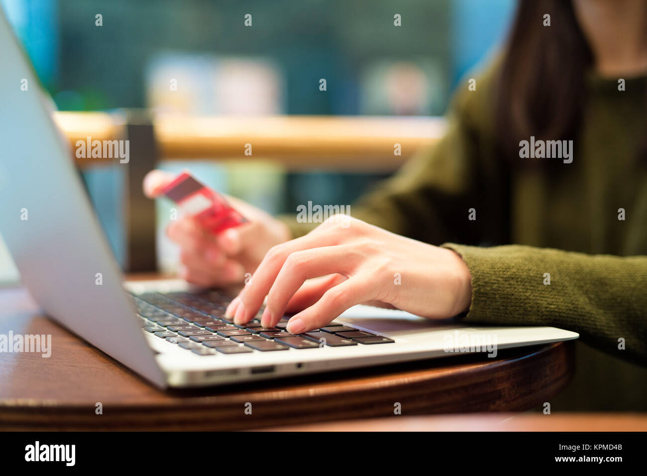 Woman using laptop computer for booking ticket Stock Photo - Alamy