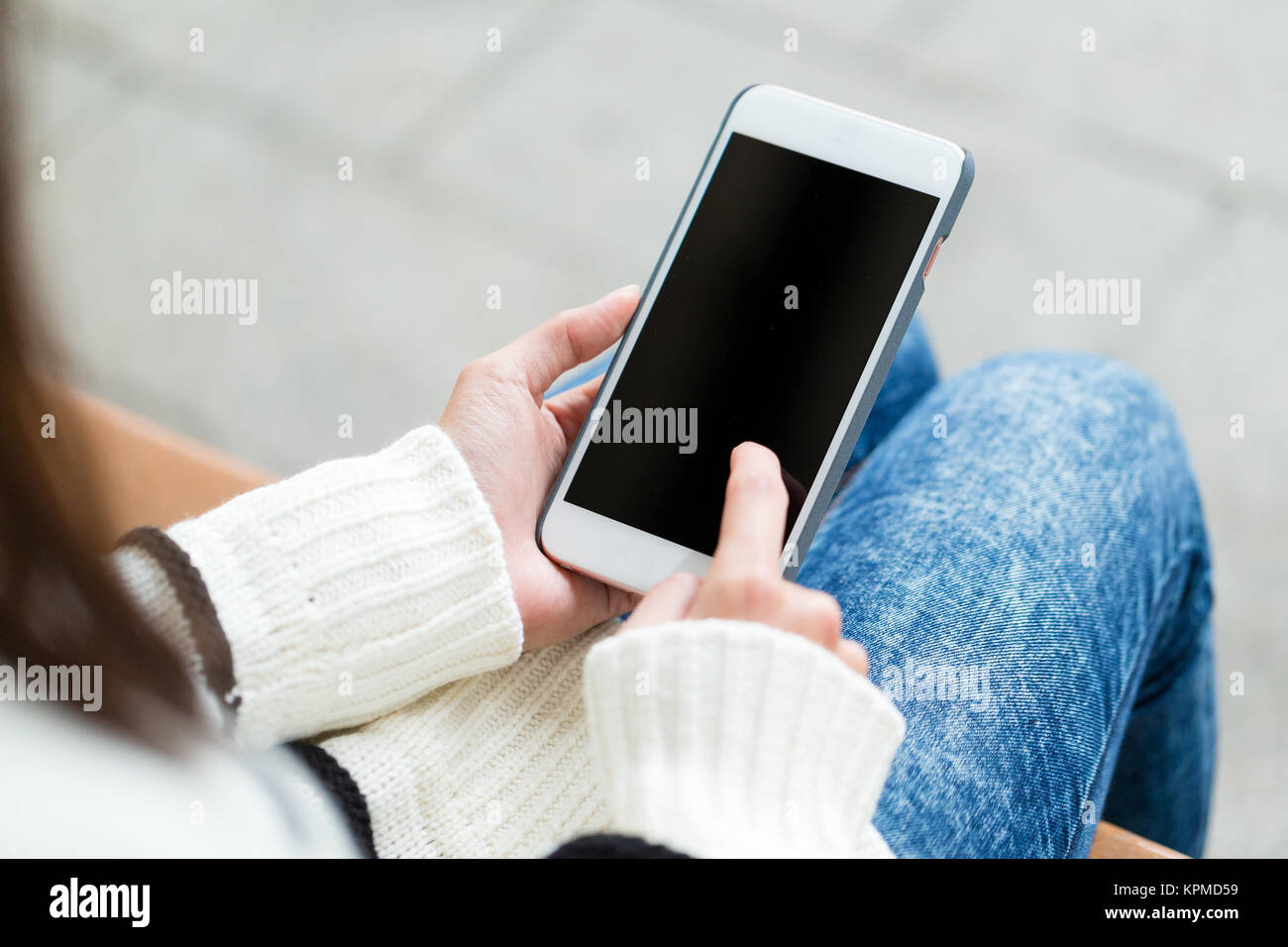 Woman touch on the screen of mobile phone Stock Photo - Alamy