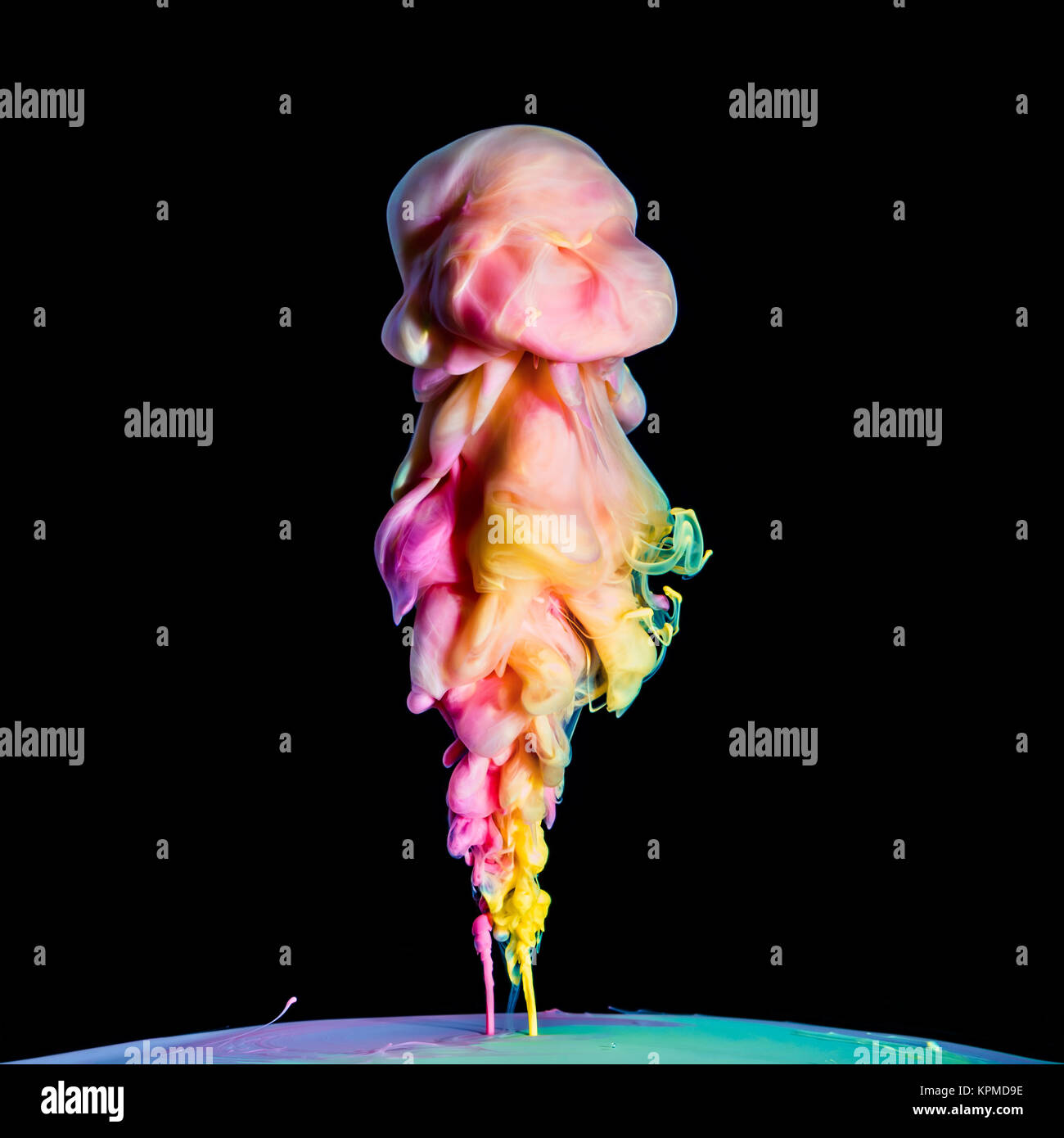 Colored inks in water on black background Stock Photo - Alamy