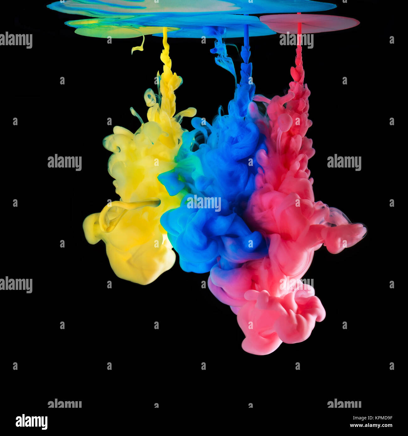 Colored inks in water on black background Stock Photo - Alamy