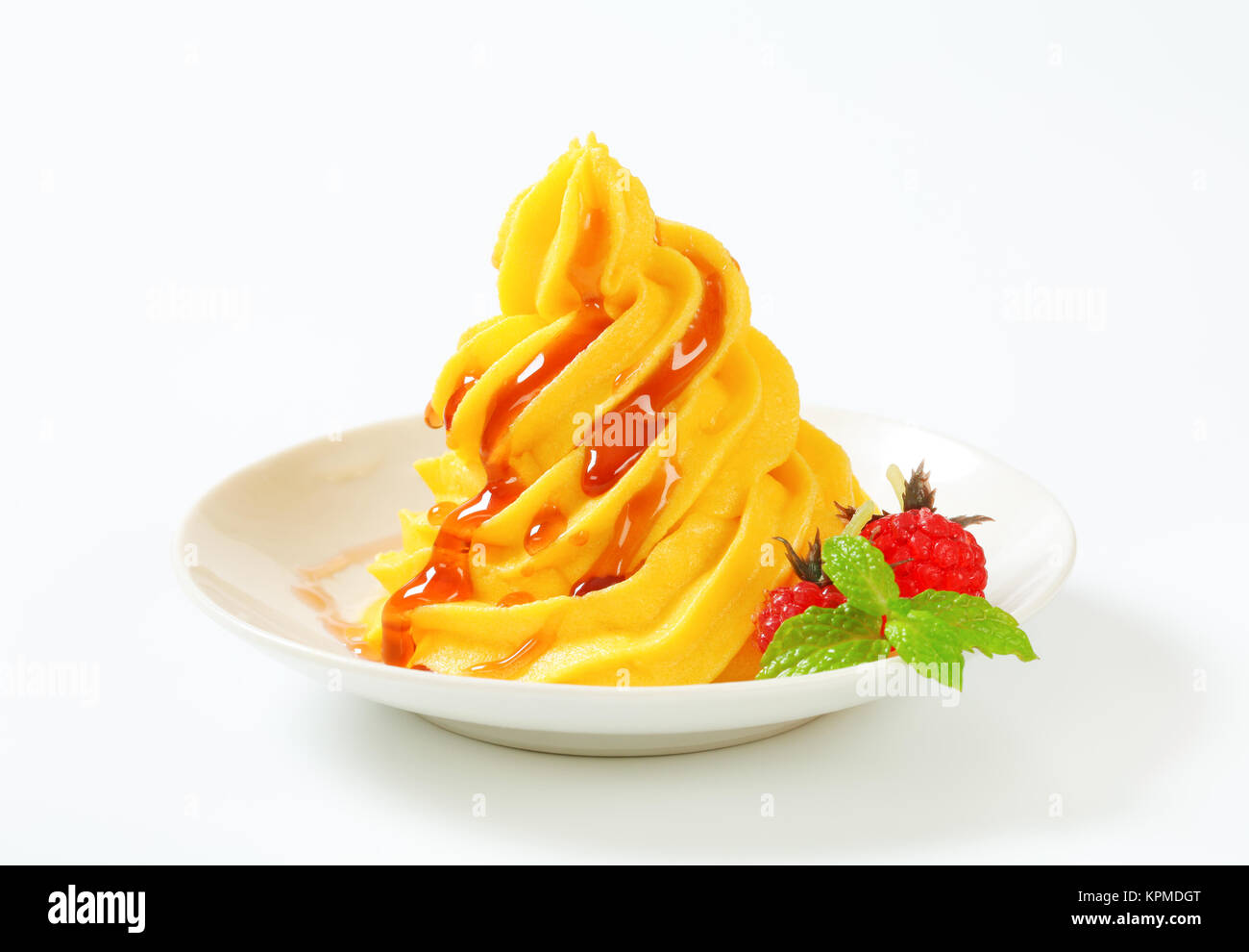 Swirl of yellow cream Stock Photo - Alamy