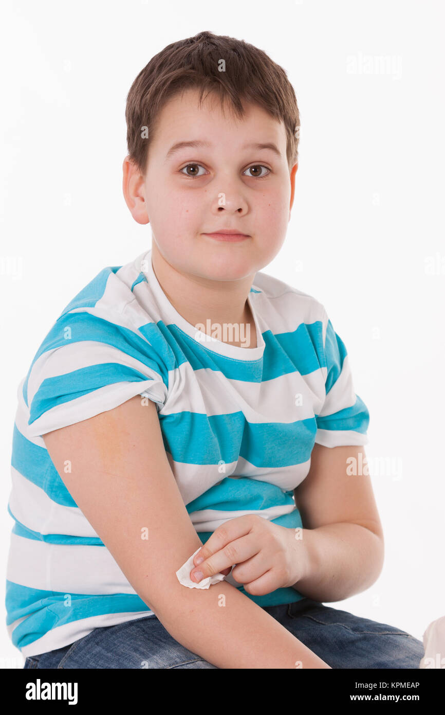 Doctor giving a child injection in arm on isolated image Stock Photo ...