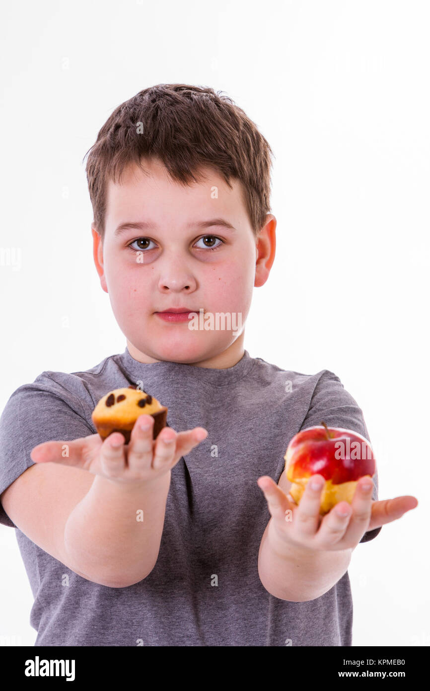 little boy with food isolated on white background - apple or a muffin ...