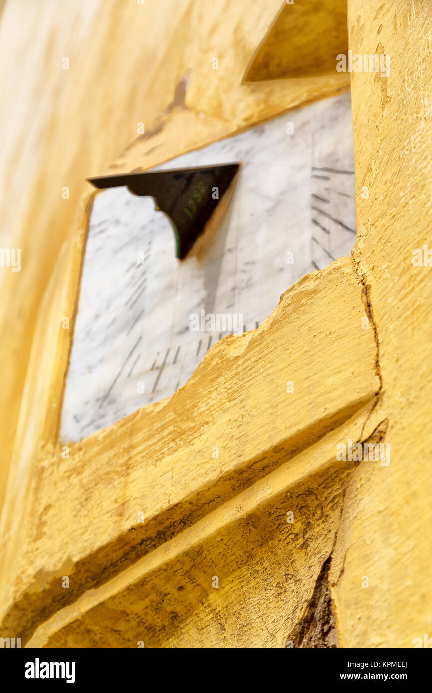 and the gnomon in the antique broken wall Stock Photo - Alamy