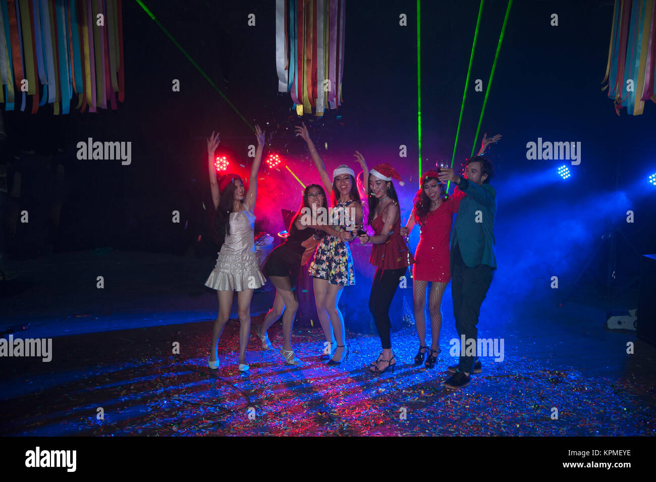 Group of people dancing at night club party and lights background Stock ...
