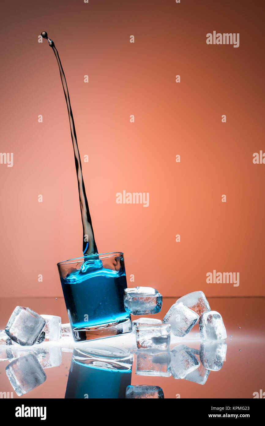 drink with blue liquid splashes stylishly Stock Photo - Alamy