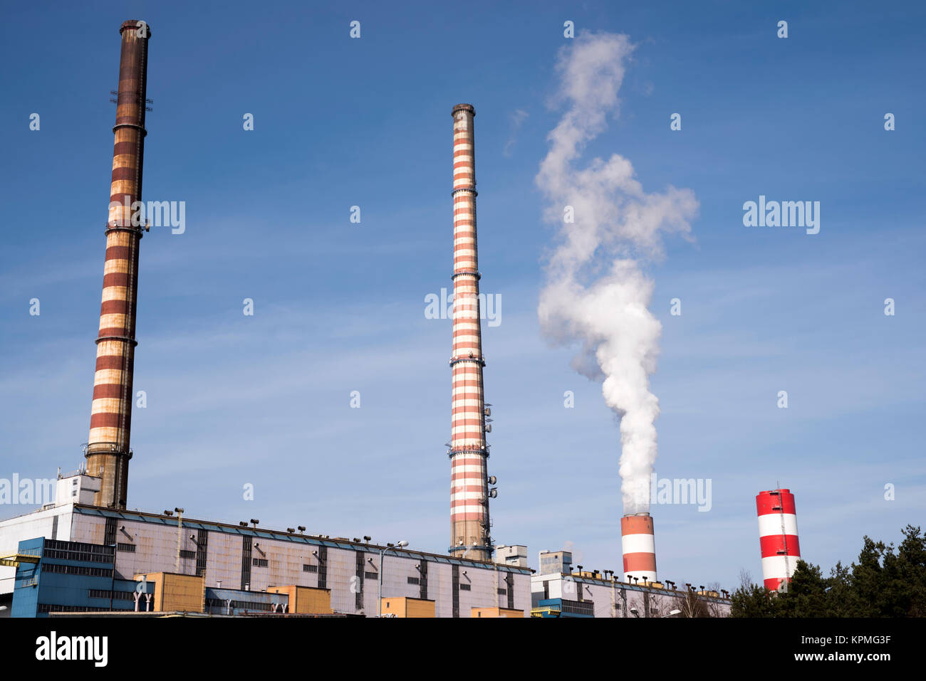 a photo of industrial buildings from factory chimneys Stock Photo - Alamy