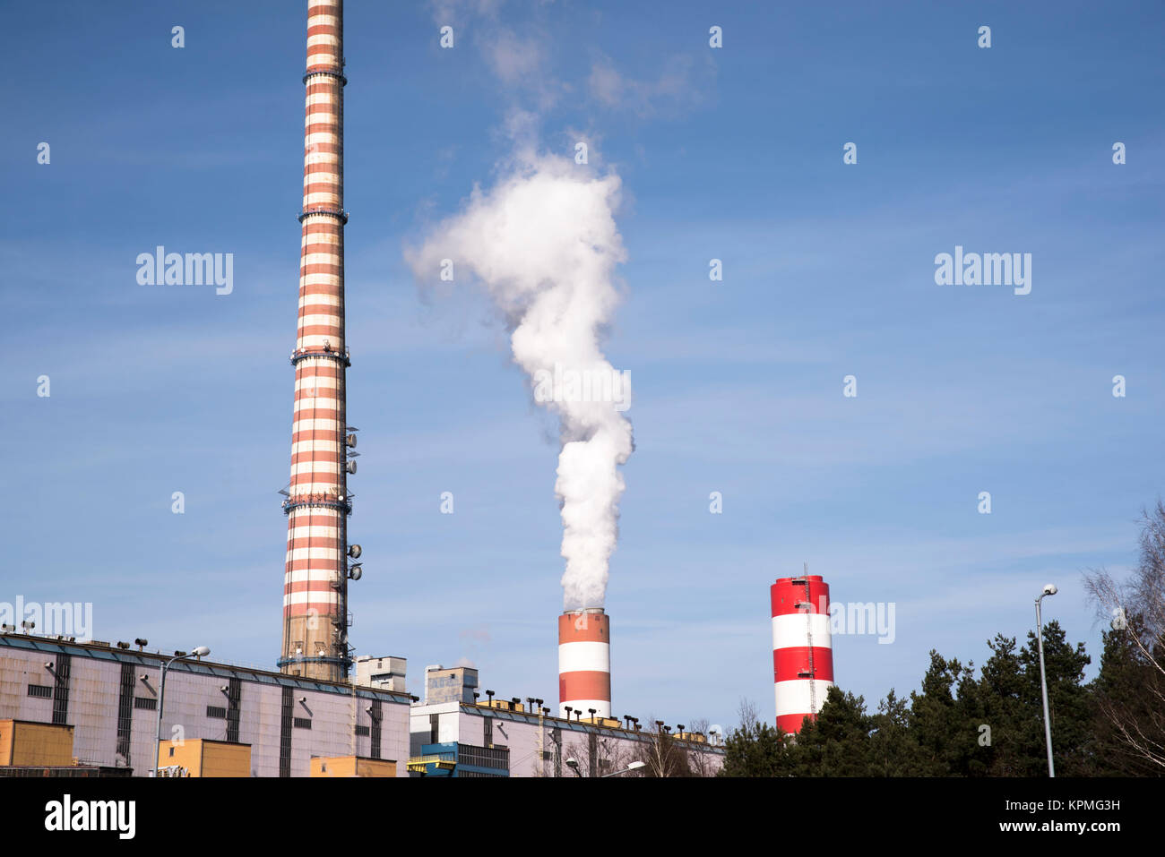 a photo of industrial buildings from factory chimneys Stock Photo - Alamy