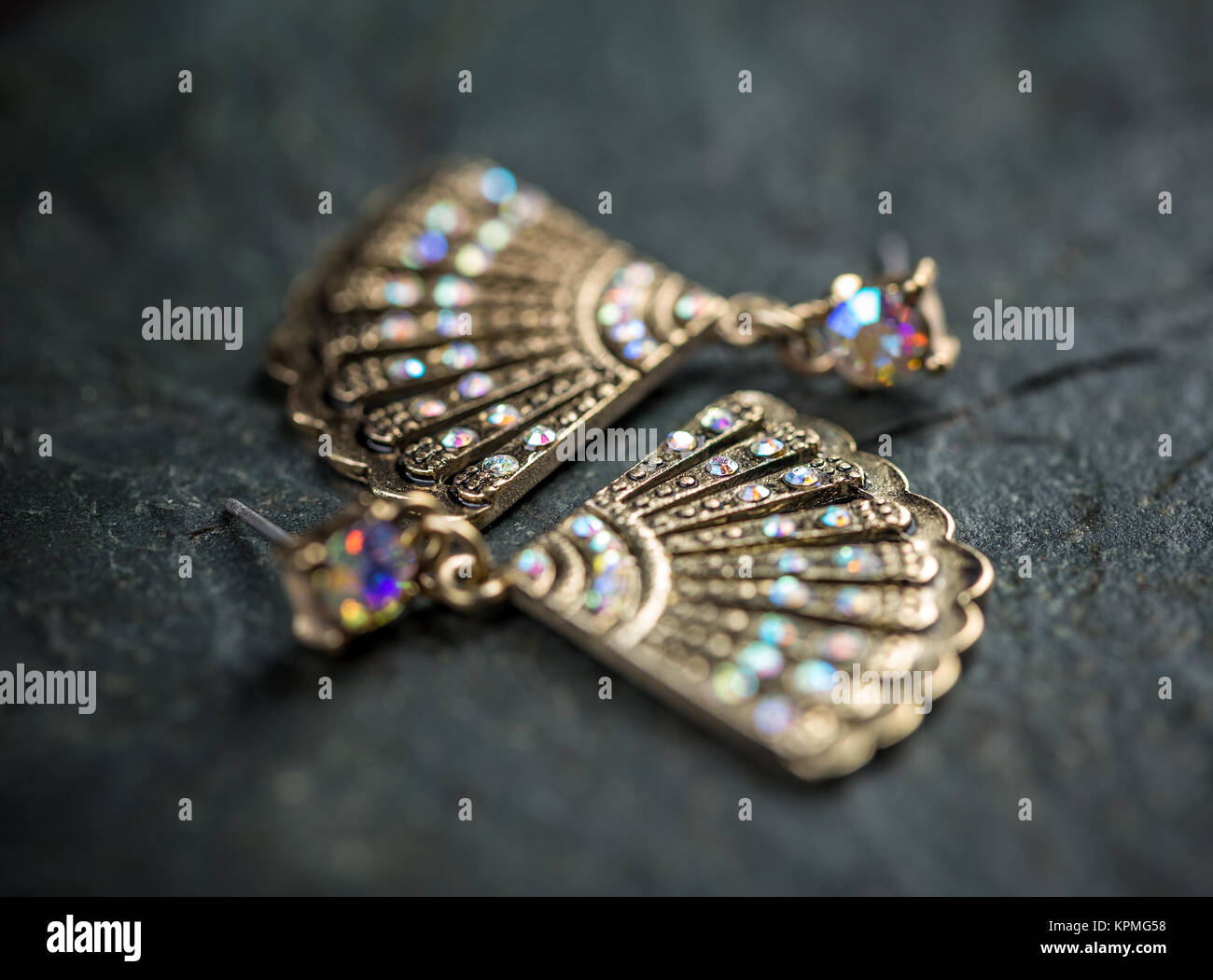 Fan shaped metal earrings Stock Photo - Alamy