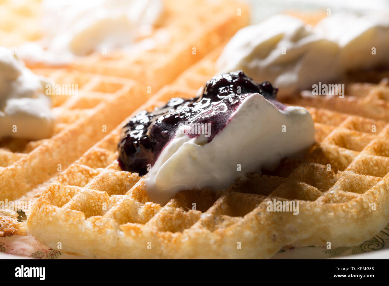 Waffle with Blueberry Jam and Whipped Cream Stock Photo - Alamy
