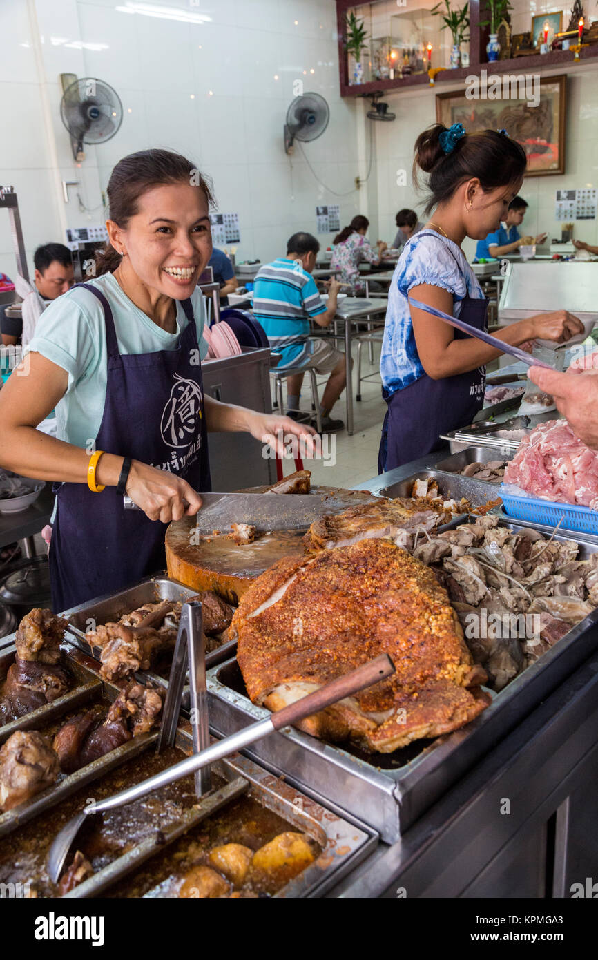 Thai woman cutting pork hi-res stock photography and images - Alamy