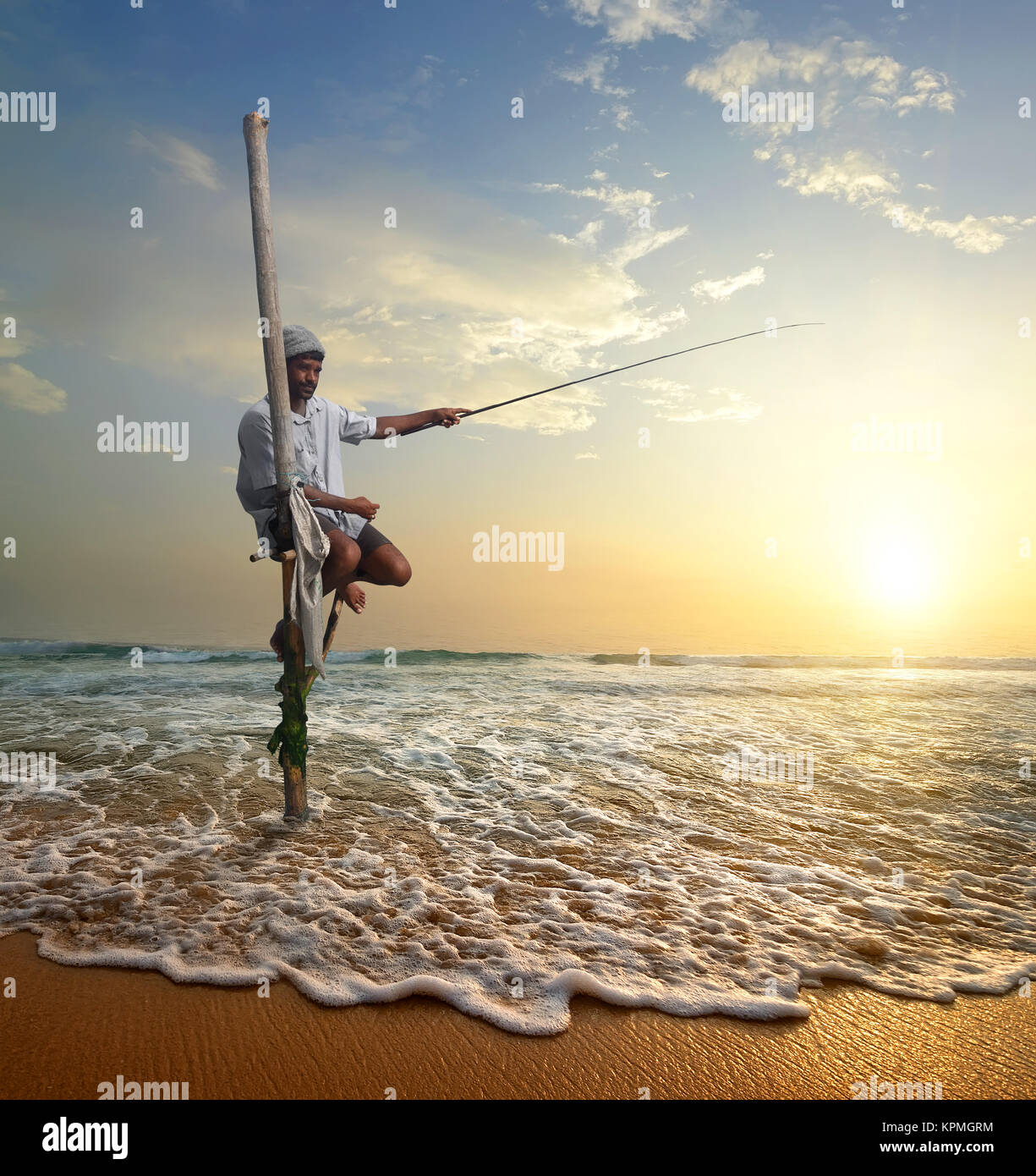 Fisherman at sunset Stock Photo - Alamy