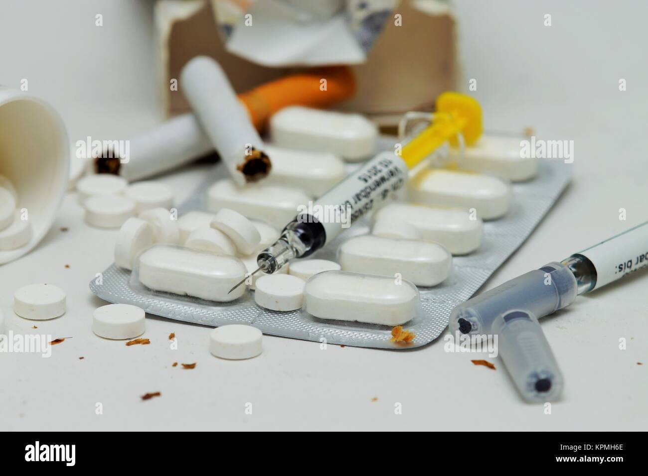 syringes and tablets lie on a table Stock Photo - Alamy